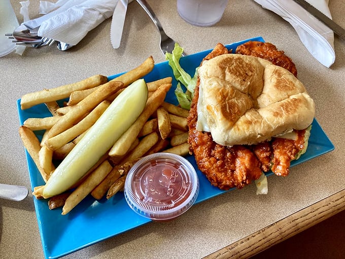 A chicken sandwich that didn't get the memo about being lunch food, bringing crispy, saucy satisfaction to the breakfast table.