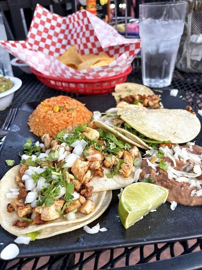 Street tacos done right—simple, authentic, and adorned with just enough cilantro and onion to make your taste buds stand at attention.