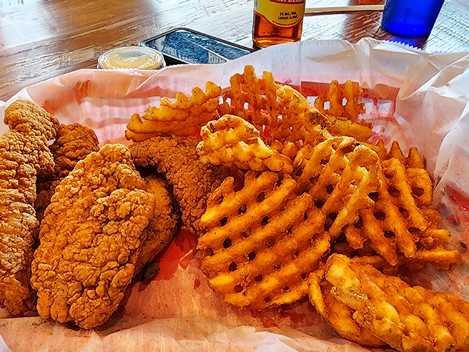 Chicken tenders and waffle fries—proof that sometimes the kids' menu has the best stuff. Crispy, golden comfort that makes adults secretly jealous of their children's orders.
