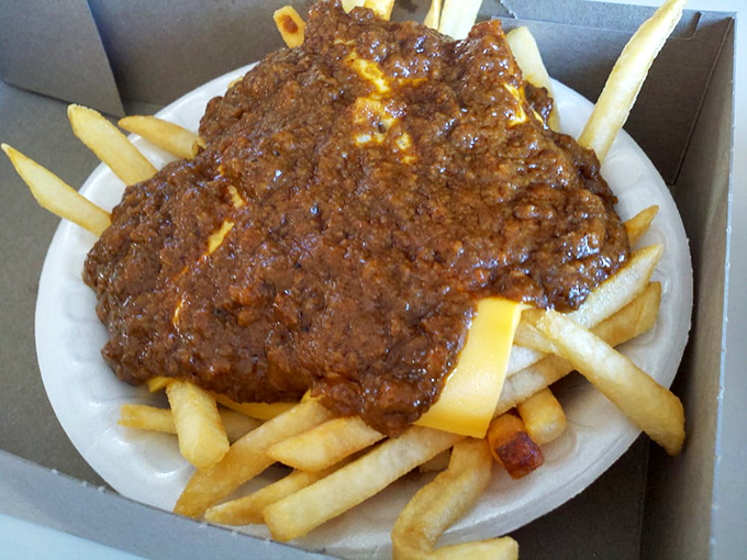 Chili cheese fries that could make a cardiologist weep—first with professional concern, then with undeniable pleasure after the first bite.
