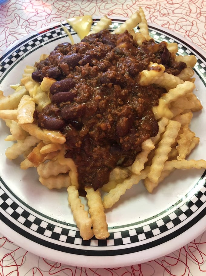 Crinkle-cut fries baptized in homemade chili—a Springfield specialty that laughs in the face of diet plans and wins hearts one meaty, cheesy bite at a time.