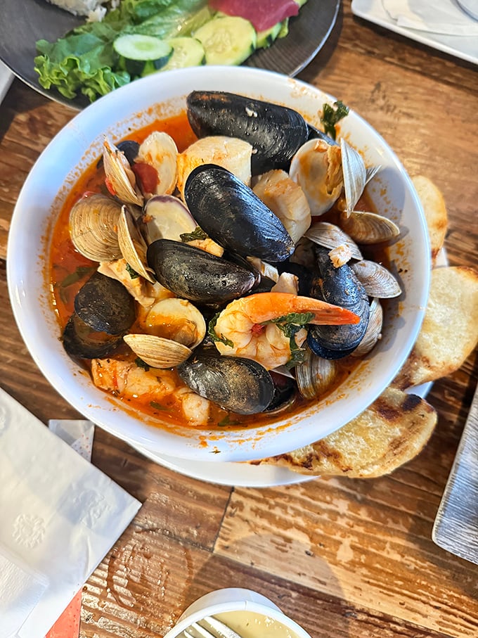 A cioppino that would make Italian fishermen weep with joy. Mussels, clams, and shrimp swimming in tomato broth—it's like the United Nations of seafood.