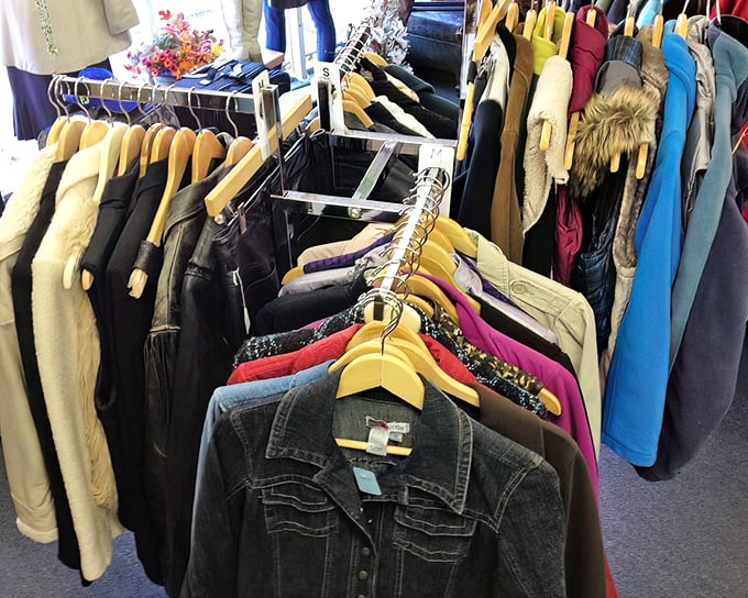 The coat section – where winter dreams and forgotten fashion statements find second chances at reasonable prices.