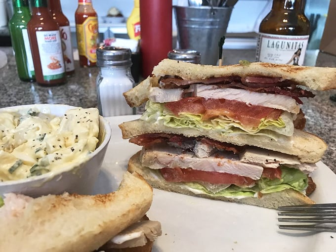 This isn't just a club sandwich—it's architectural genius with layers of flavor that puts most downtown high-rises to shame.