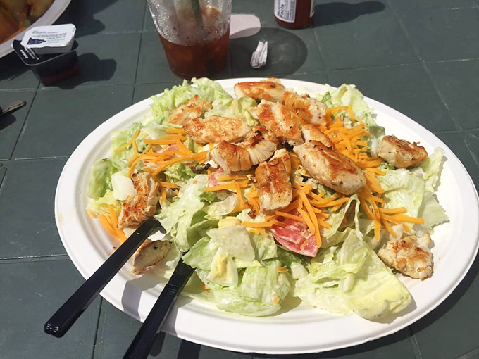 A salad that doesn't apologize for being a salad—crisp, colorful, and topped with enough protein to keep you going through an afternoon of beach volleyball.