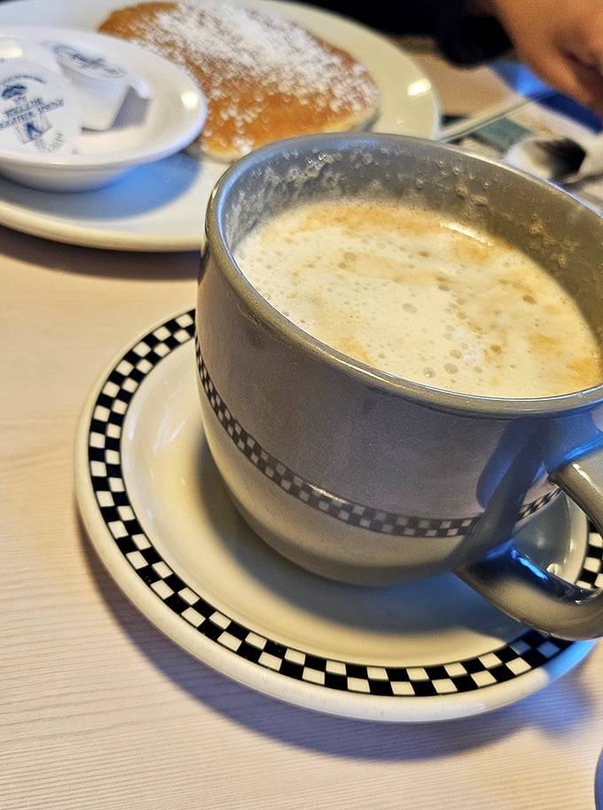 Coffee in a proper diner mug – the kind that feels like it's been warming hands and starting conversations since the Eisenhower administration.