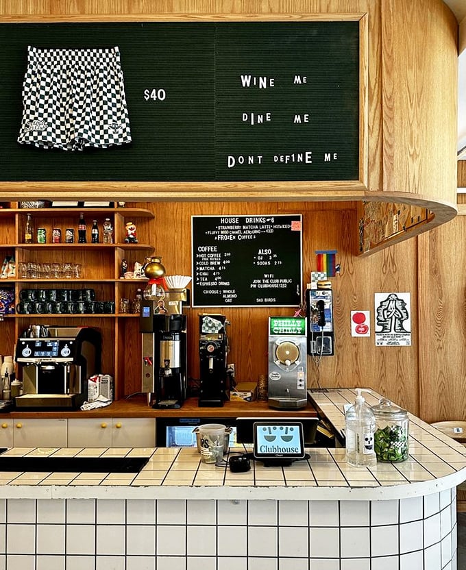 "Wine me, dine me, don't define me"—the coffee bar's cheeky signage perfectly captures the establishment's playful, irreverent spirit.