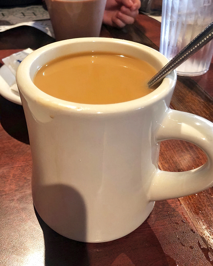 Coffee served in the classic diner mug—thick-walled, no-nonsense, and ready for business. This isn't just caffeine—it's liquid motivation in ceramic armor.