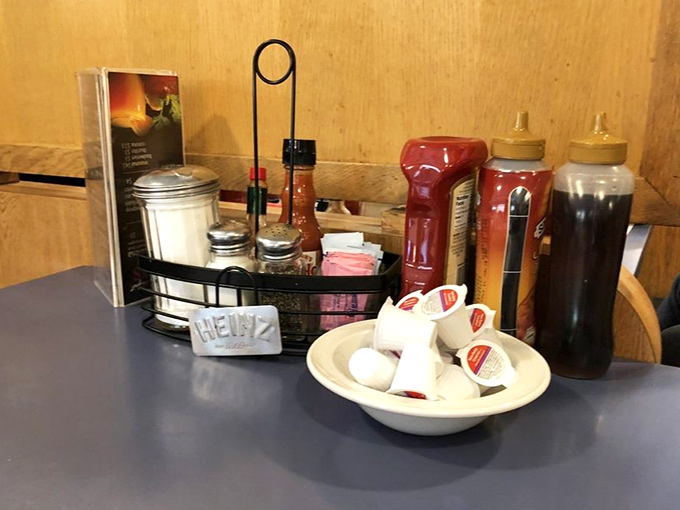 The condiment caddy—that unsung hero of personalization, allowing you to doctor your meal to perfection without a medical license.