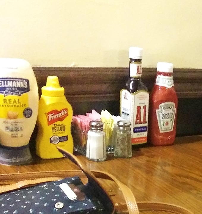 The condiment lineup—humble supporting actors that never steal the scene but make everything taste just a little bit better.