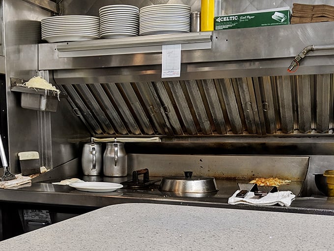 No molecular gastronomy here—just the timeless ballet of short-order cooking performed on well-seasoned equipment.