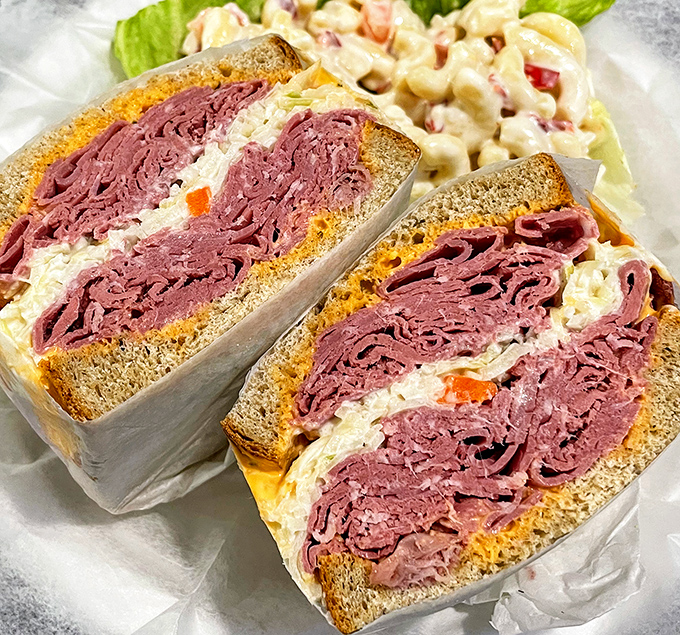 This corned beef sandwich doesn't just have layers—it has geological strata of meat that archaeologists would need permits to excavate.