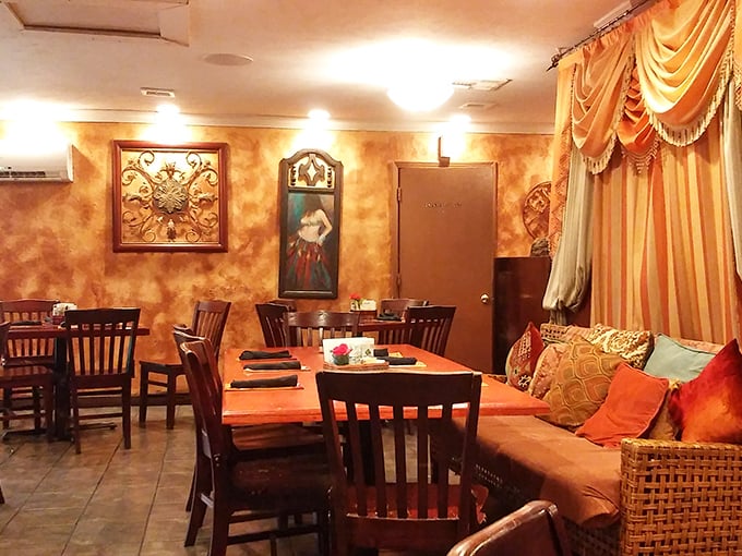 The cozy corner with its golden walls and draped fabrics isn't just seating—it's a stage set for the memory-making meal that's about to unfold.