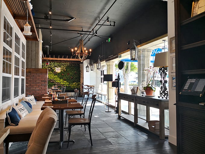 The living room you wish you had—cozy seating, warm lighting, and the promise of incredible food just steps away.