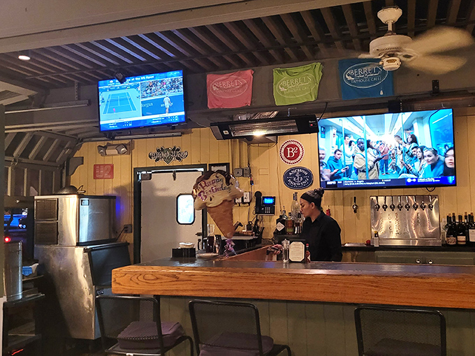 The bar area—where sports on TV and colorful pennants create that perfect casual vibe for enjoying oysters and craft beer without pretension.