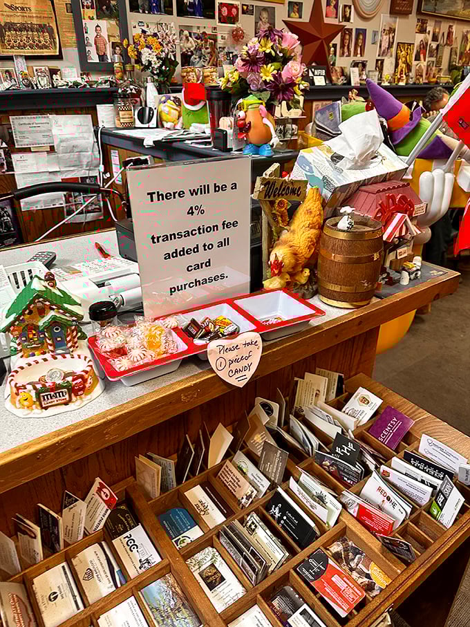 The counter area doubles as a small-town museum, where business cards and candy coexist in a delightful jumble of local commerce.