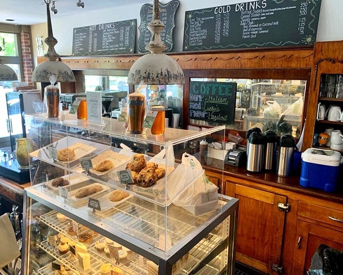 The counter and pastry case—where willpower goes to die and "I'll just have coffee" turns into "and one of each, please." 