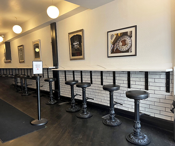 The counter seats—where solo diners become temporary members of the Cheesesteak Appreciation Society. No membership cards required.