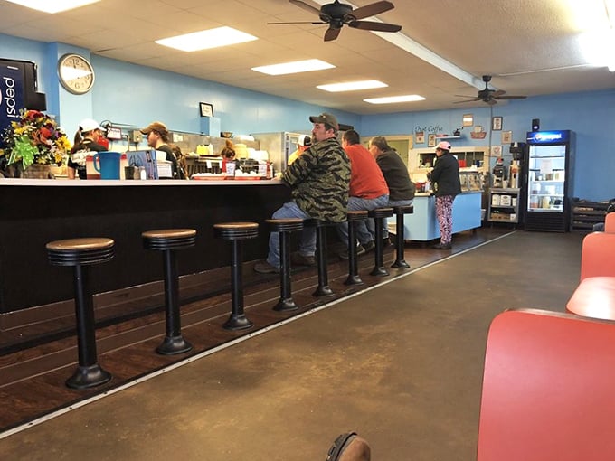 The counter seats – where solo diners become family and the staff remembers your order before you've fully settled onto your stool.