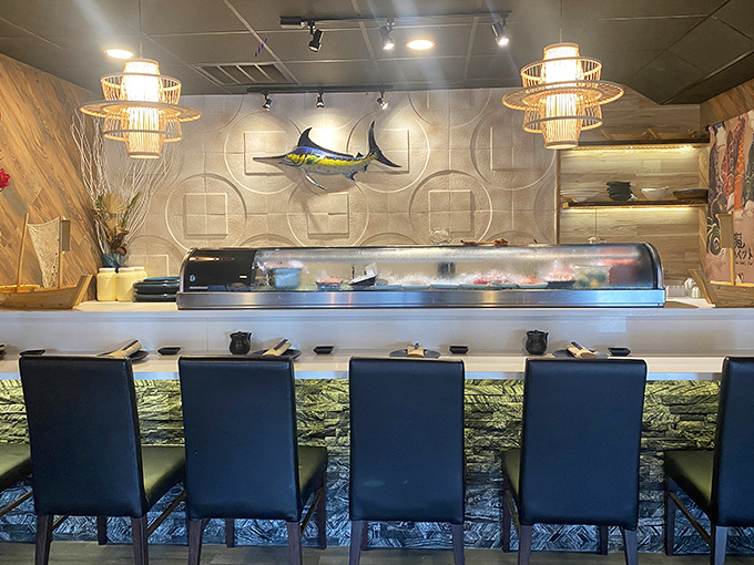 The sushi counter—where dinner becomes theater and chefs transform raw ingredients into edible art right before your eyes.