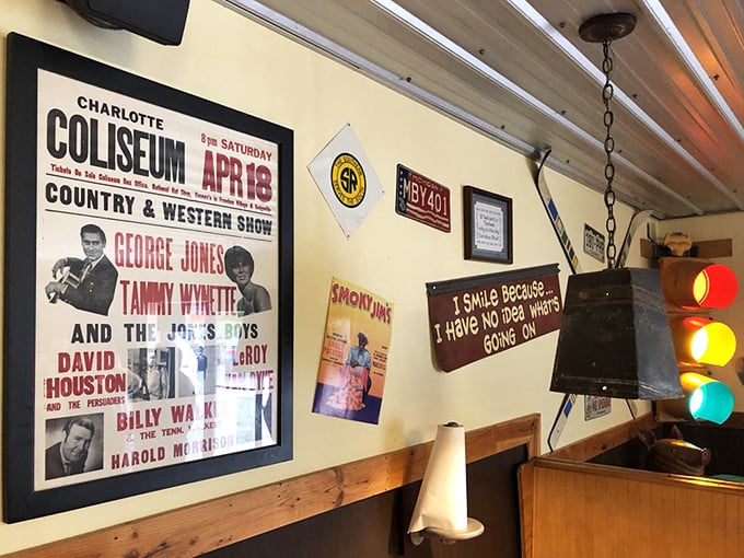 Wall décor that tells stories of Southern music legends. George Jones would approve of eating barbecue while admiring his poster.