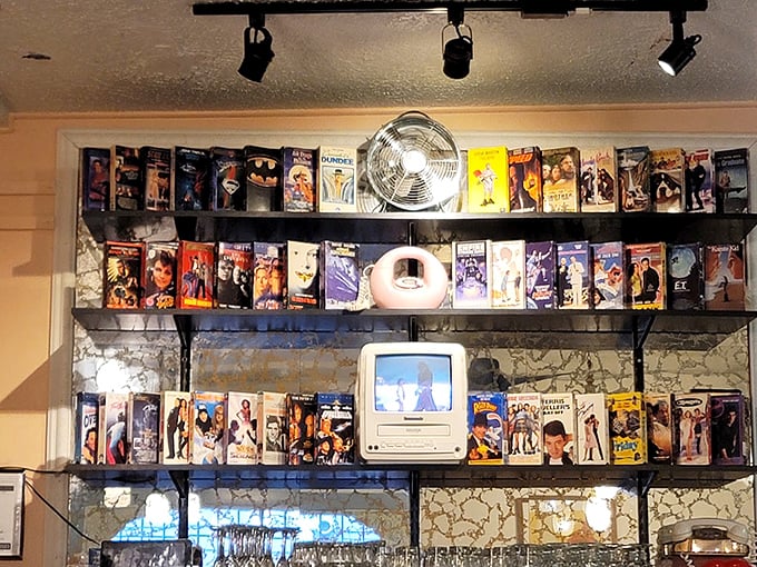 VHS tapes line the shelves like a museum of movie nights past—a charming reminder of when "streaming" just meant you forgot to rewind.