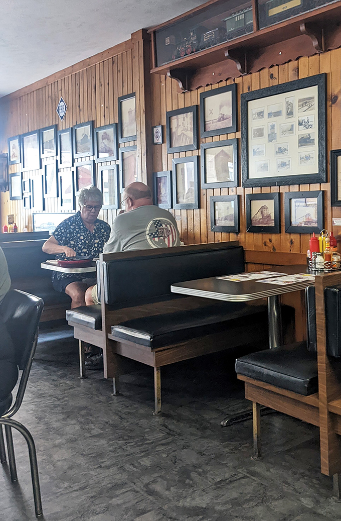 The quintessential American diner scene—where conversations flow as freely as the coffee. Democracy in action, one booth at a time.