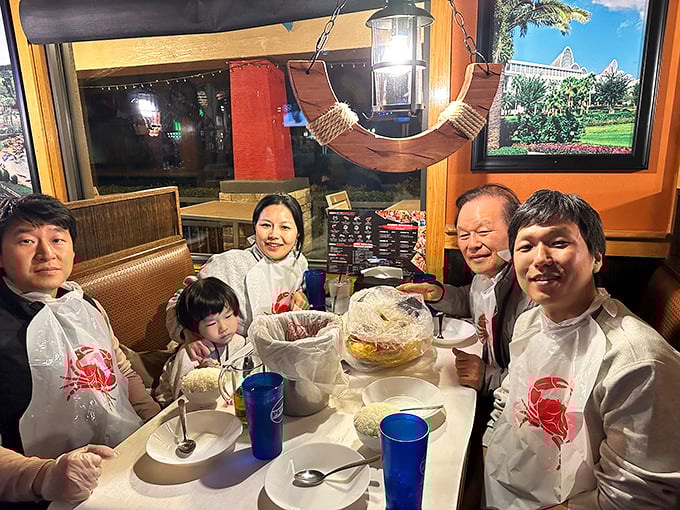 Plastic bibs aren't just practical—they're ceremonial robes that initiate you into the messy, joyful cult of seafood lovers.