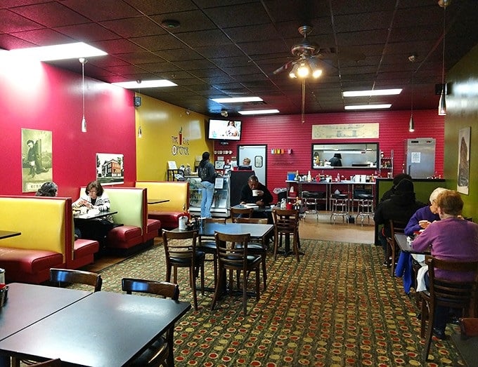 A colorful dining area where breakfast stories unfold daily—some tables witness first dates while others host decades-long friendship rituals.