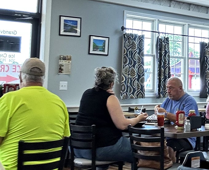 Where strangers become united by the universal language of good food. Notice the focused expressions—that's what culinary bliss looks like.