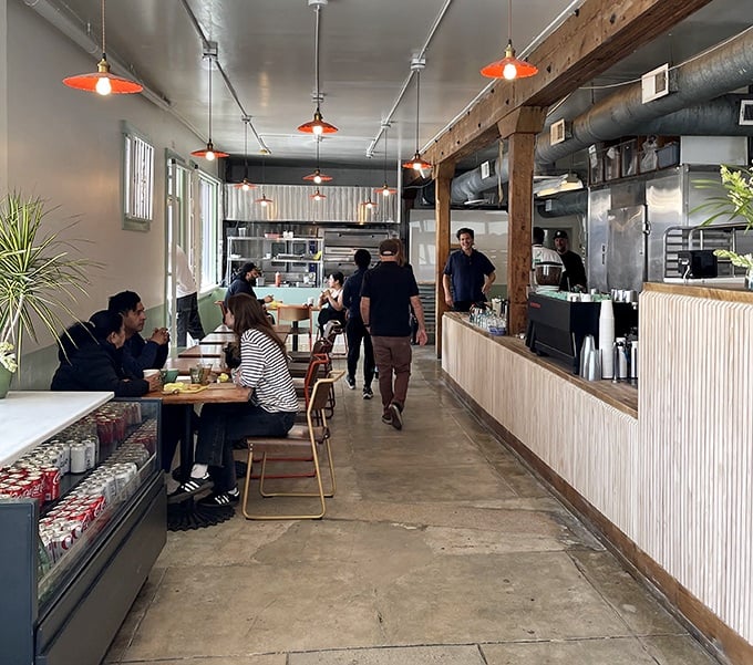 The narrow space buzzes with energy as diners savor their finds, proving good food needs no elaborate staging—just honest flavors.