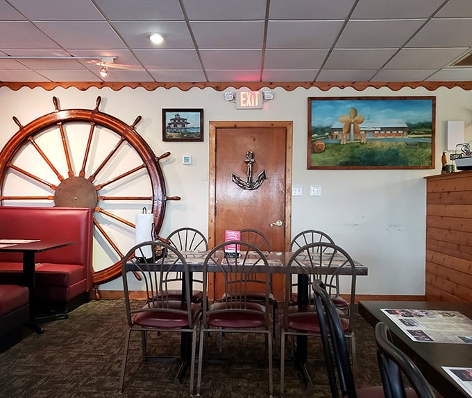 Another angle of the dining room reveals the perfect balance of maritime kitsch and practical comfort—where memories are made between bites.