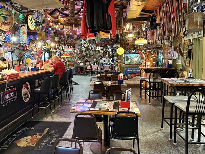 The dining area isn't just a room—it's a carefully curated collection of decades of fishing culture, beer signs, and Midwestern memories.