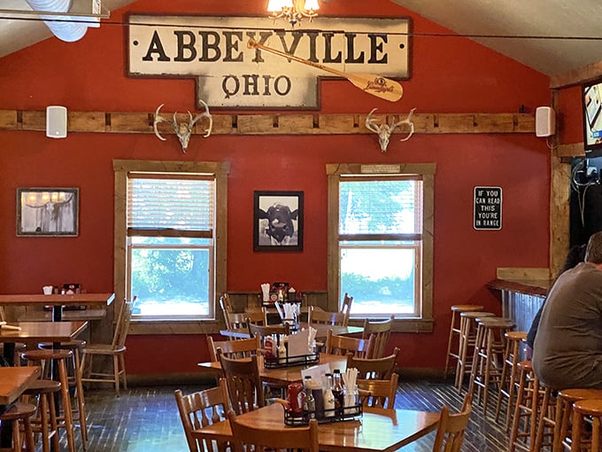 The "Abbeyville" dining room—where BBQ prayers are answered daily. Those wooden chairs have supported countless satisfied customers through epic meals.