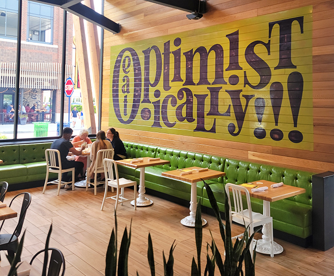"Eat Optimistically!" The wall proclaims what the green banquette seating suggests: positivity pairs perfectly with nutritious food that actually tastes good.