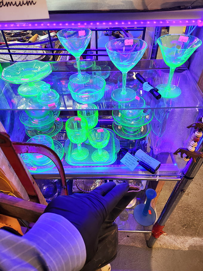 Uranium glass cocktail sets glowing under blacklight – midcentury modern meets sci-fi chic in these conversation pieces that practically pour themselves.
