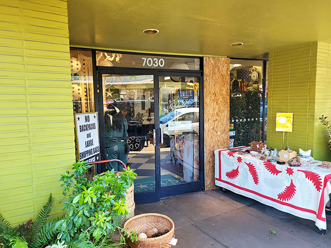 The unassuming entrance, complete with sidewalk displays, beckons like a portal to Portland's most fascinating parallel universe of vintage treasures.