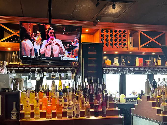 A liquid rainbow of spirits lines the bar, promising cocktails that might have you joining the napkin-throwing festivities before your entrée arrives.