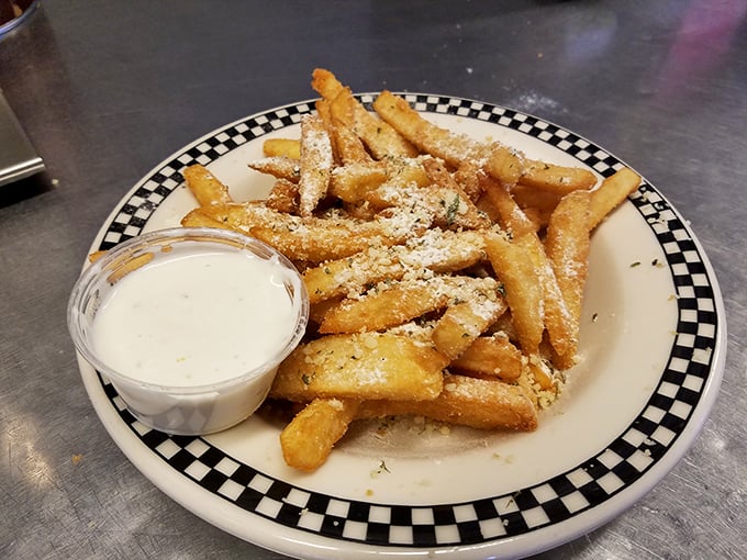 "Eastside Fries"—golden potato sticks dusted with parmesan and served with dipping sauce. Proof that sometimes the simplest pleasures are the most satisfying.