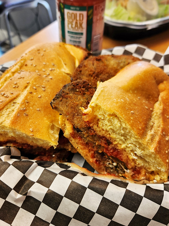 This isn't just an eggplant parm sandwich—it's architecture. Golden bread supporting layers of breaded eggplant and sauce in perfect harmony.