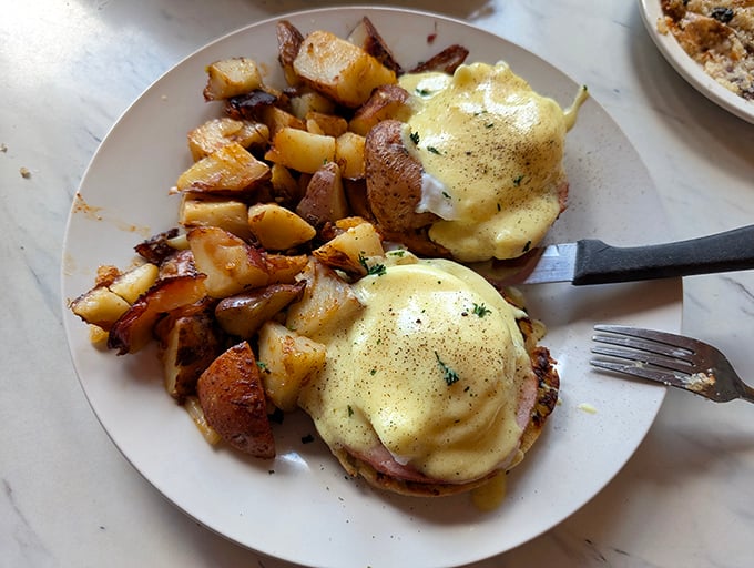 Eggs Benedict that would make a brunch enthusiast weep with joy—hollandaise sauce applied with the precision of a Renaissance painter.
