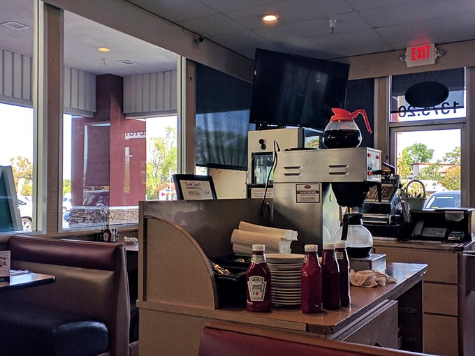 The command center where coffee magic happens. Every great diner has this view—organized chaos producing consistent comfort.