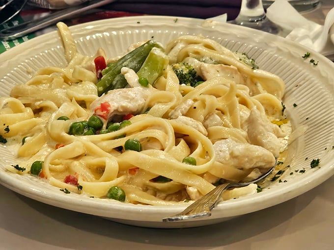 Fettuccine primavera that's creamy without being heavy—a pasta performance where each vegetable plays its supporting role perfectly.