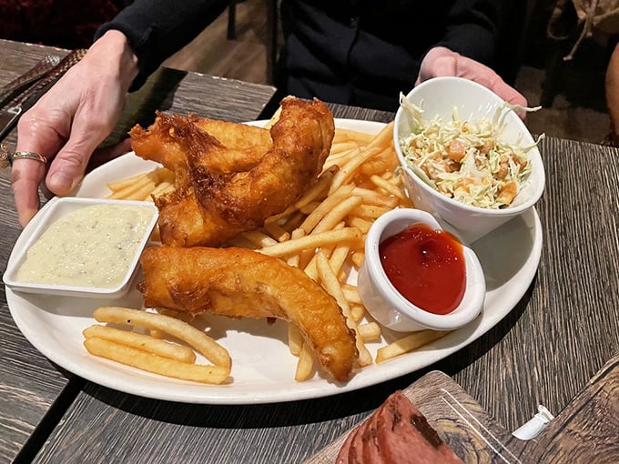 Fish and chips that would make a British pub proud—golden-battered cod with a crunch you can hear across the restaurant.