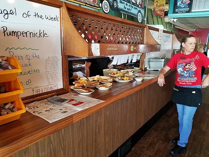 Where breakfast magic happens—the pass-through window offering glimpses of culinary choreography and the promise of pancakes to come.