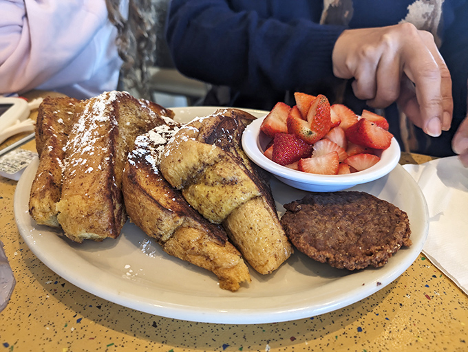French toast that's crossed the line from breakfast to dessert, with strawberries adding that touch of "See? It's still healthy!"
