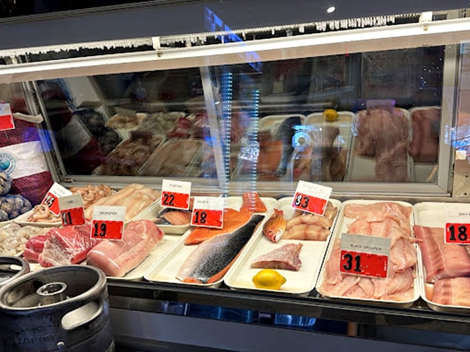 Behind the glass lies the day's catch—a rainbow of seafood possibilities that will soon become someone's unforgettable meal.