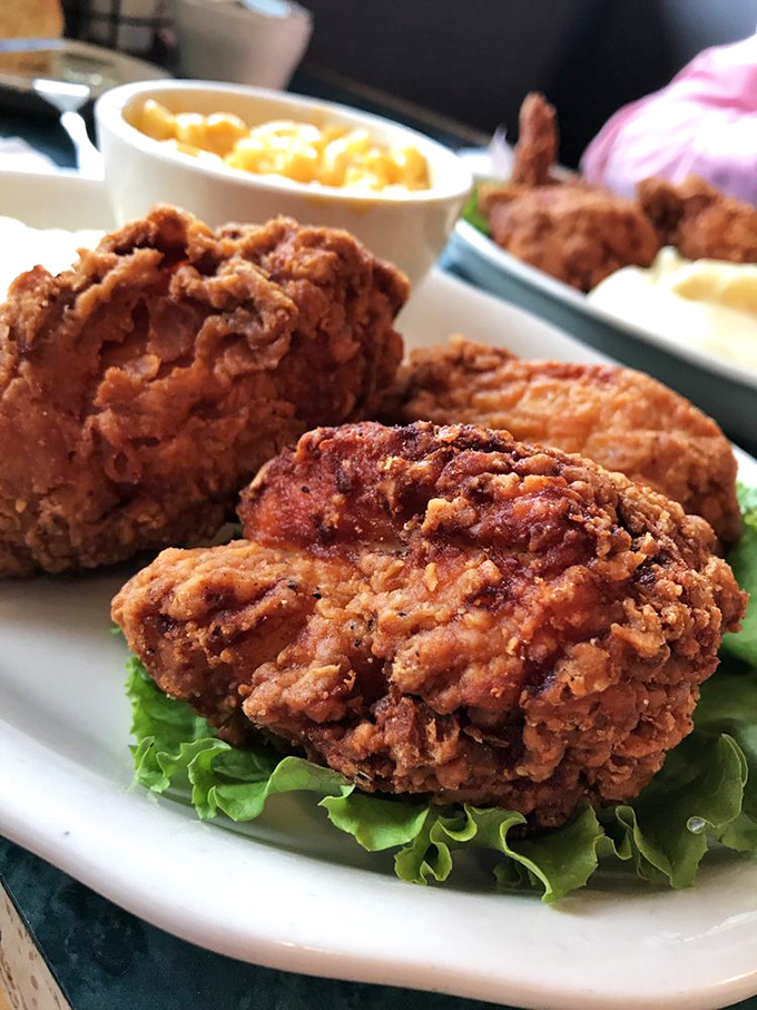 Fried chicken that would make Colonel Sanders weep with jealousy – crispy, juicy, and seasoned so perfectly you'll forget hot sauce exists.