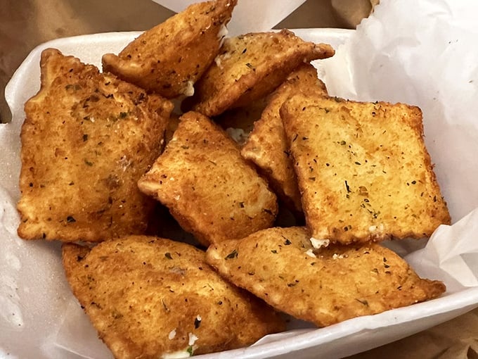 Fried ravioli squares – crispy on the outside, molten on the inside – proof that Beto's magic extends beyond their signature pizza.
