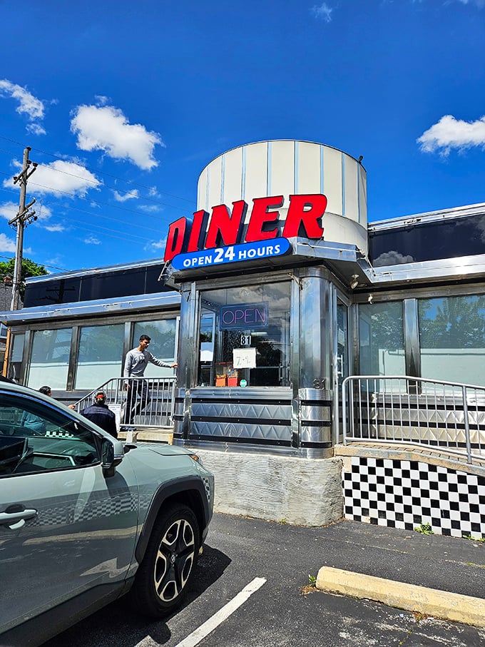 Daylight reveals the diner's true colors—a stainless steel time capsule where breakfast is always just minutes away, 24 hours a day.